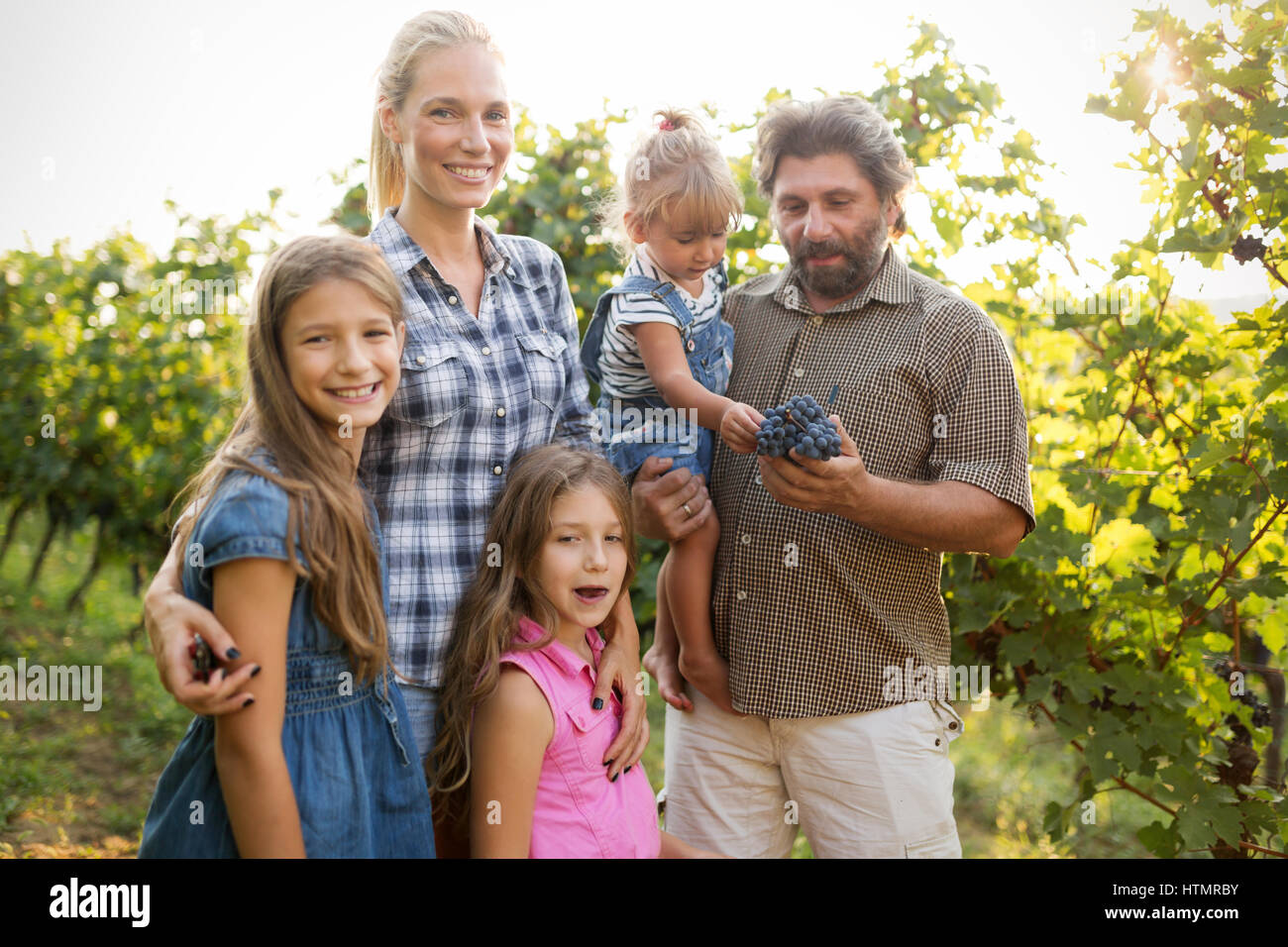 Winemaker family happy together in vineyard before harvesting Stock ...