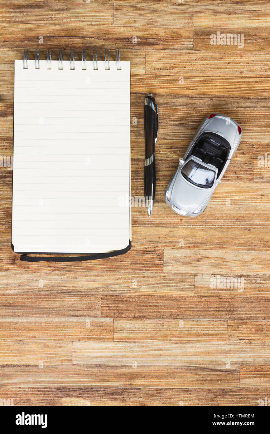 Toy car with notebook Stock Photo - Alamy