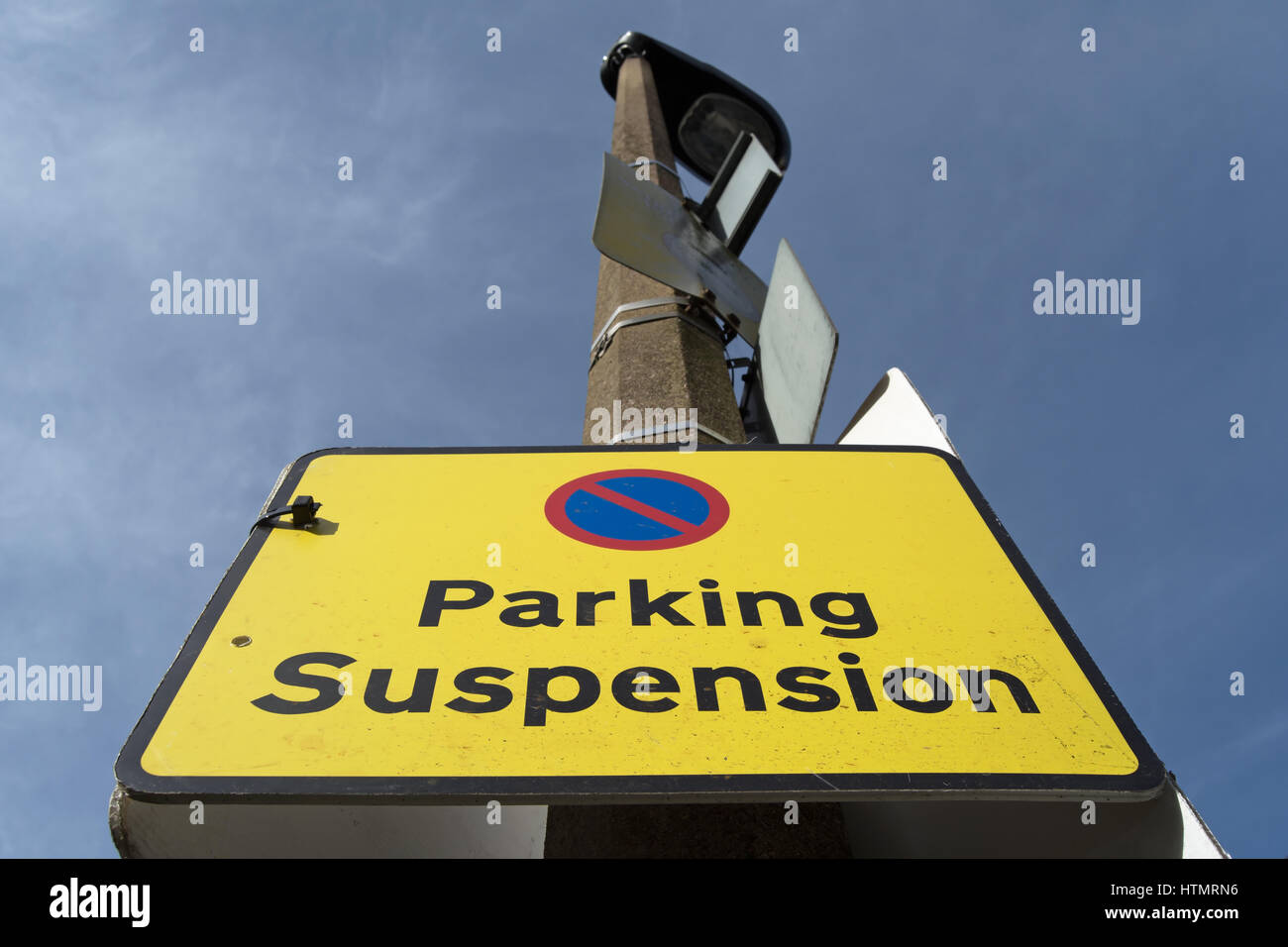 parking suspension sign fixed to lamppost Stock Photo - Alamy