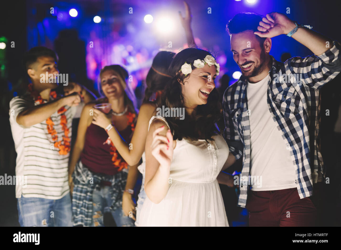 Group of happy friends dancing at festival outdoors Stock Photo - Alamy