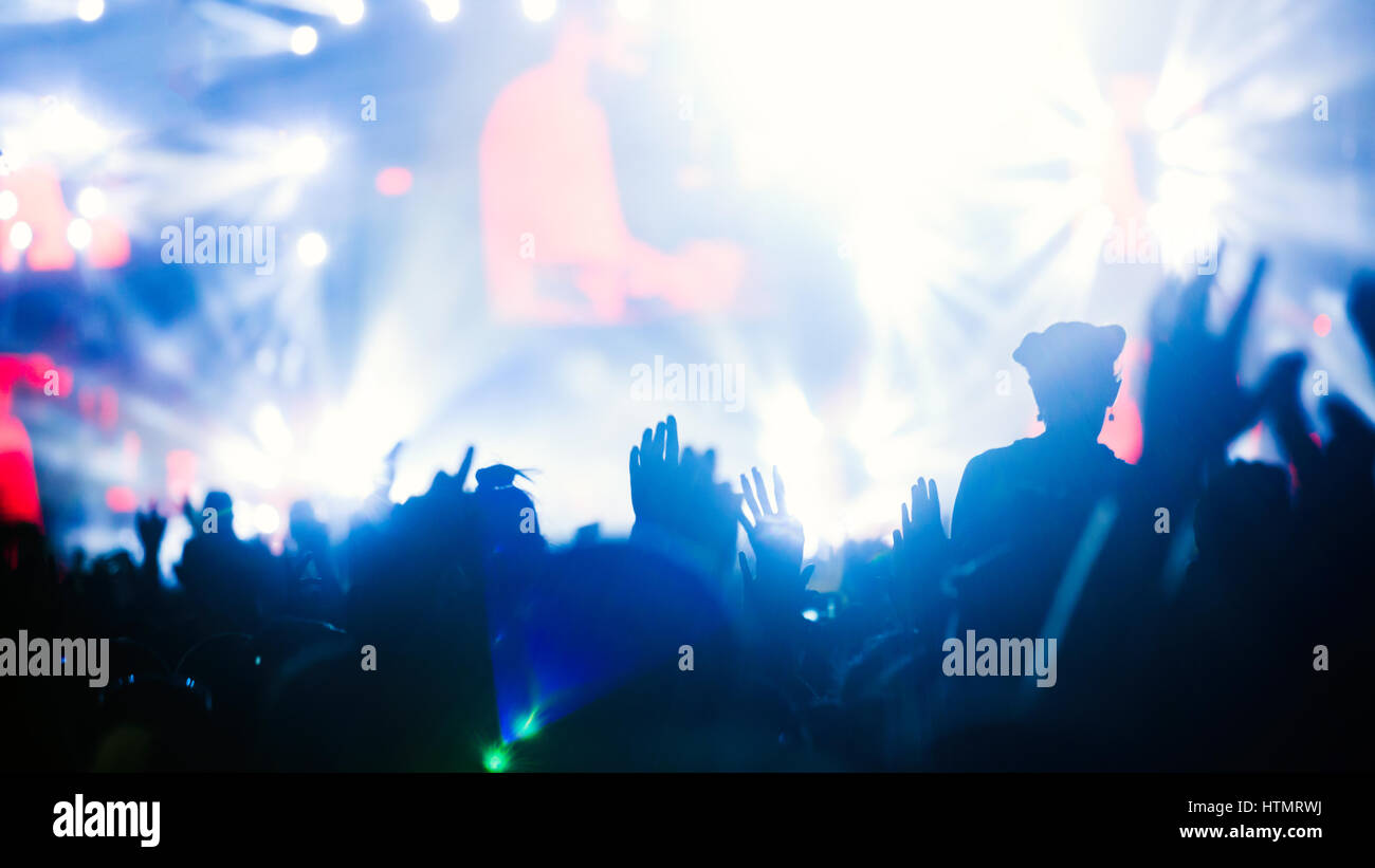 Crowd enjoying concert at festival dancing and partying Stock Photo - Alamy