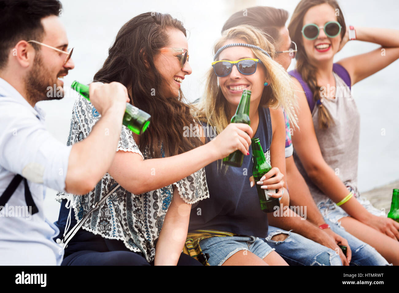 Party friends drinking before summer festival outdoor Stock Photo - Alamy
