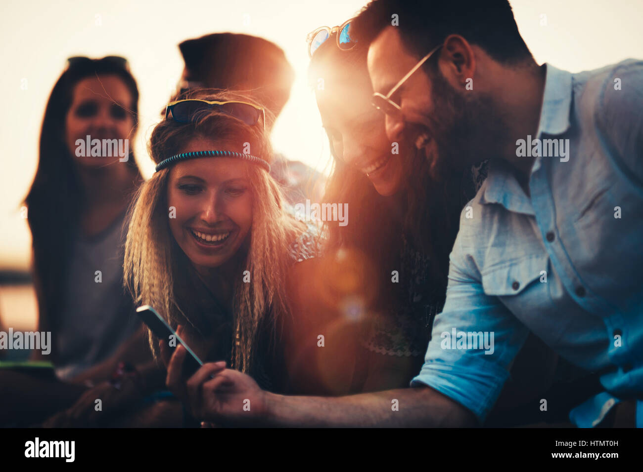 Happy friends outdoors having fun and partying in summer Stock Photo ...