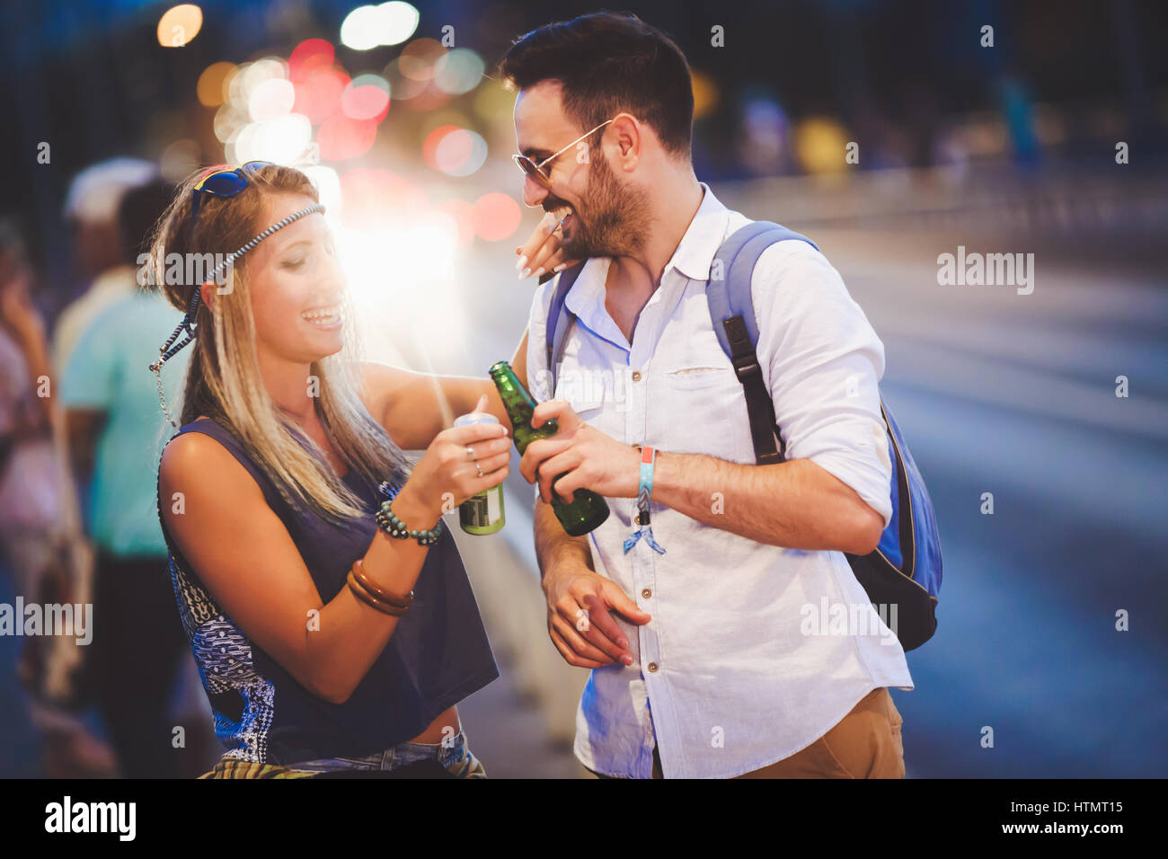 Couple drinking alcohol at night in city before festival Stock Photo ...