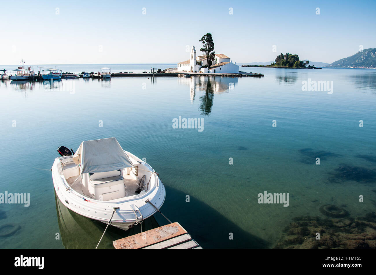 Church and Boat. The church of Panagia Vlacherna and the island of ...