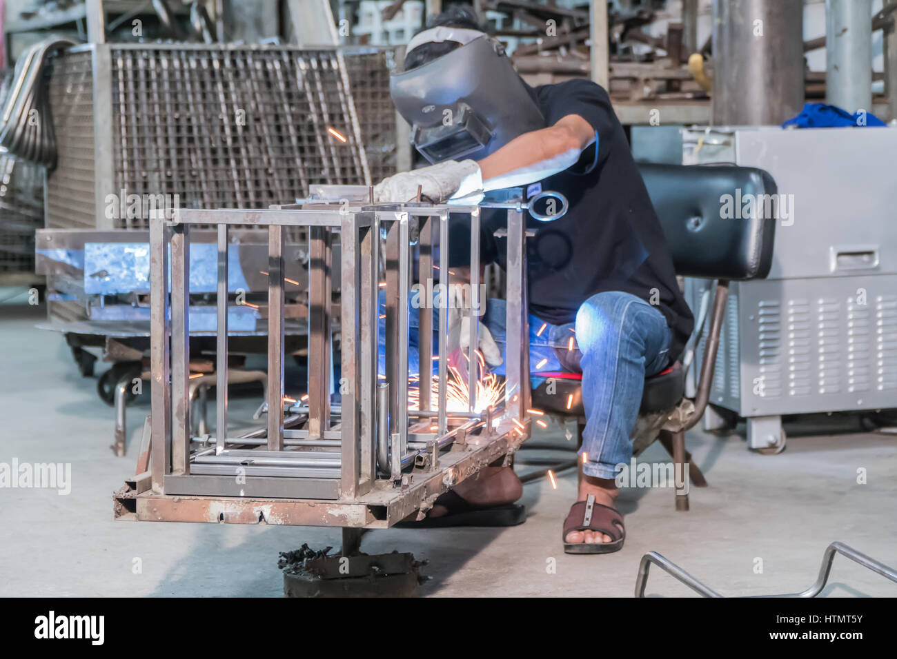 Making sure he's protected while welding Stock Photo - Alamy Making sure he's protected while welding Stock Photo - Alamy