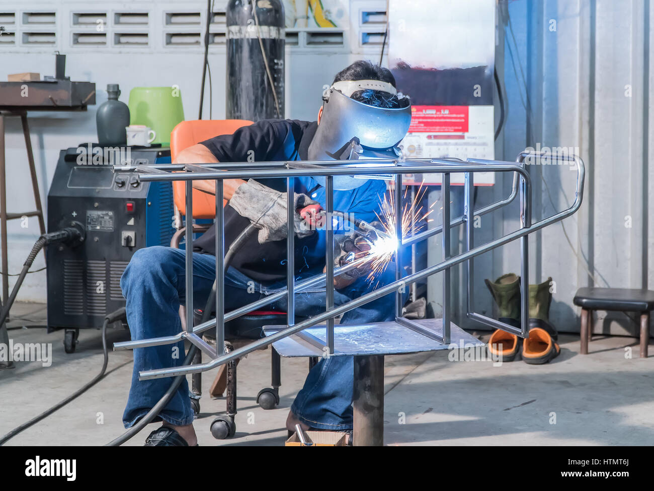 Making sure he's protected while welding Stock Photo - Alamy Making sure he's protected while welding Stock Photo - Alamy