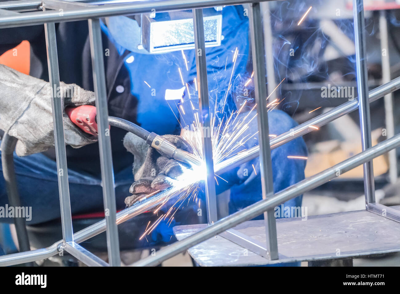 Making sure he's protected while welding Stock Photo - Alamy Making sure he's protected while welding Stock Photo - Alamy