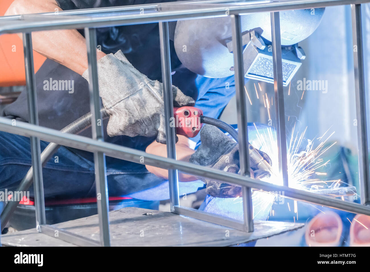 Making sure he's protected while welding Stock Photo - Alamy Making sure he's protected while welding Stock Photo - Alamy