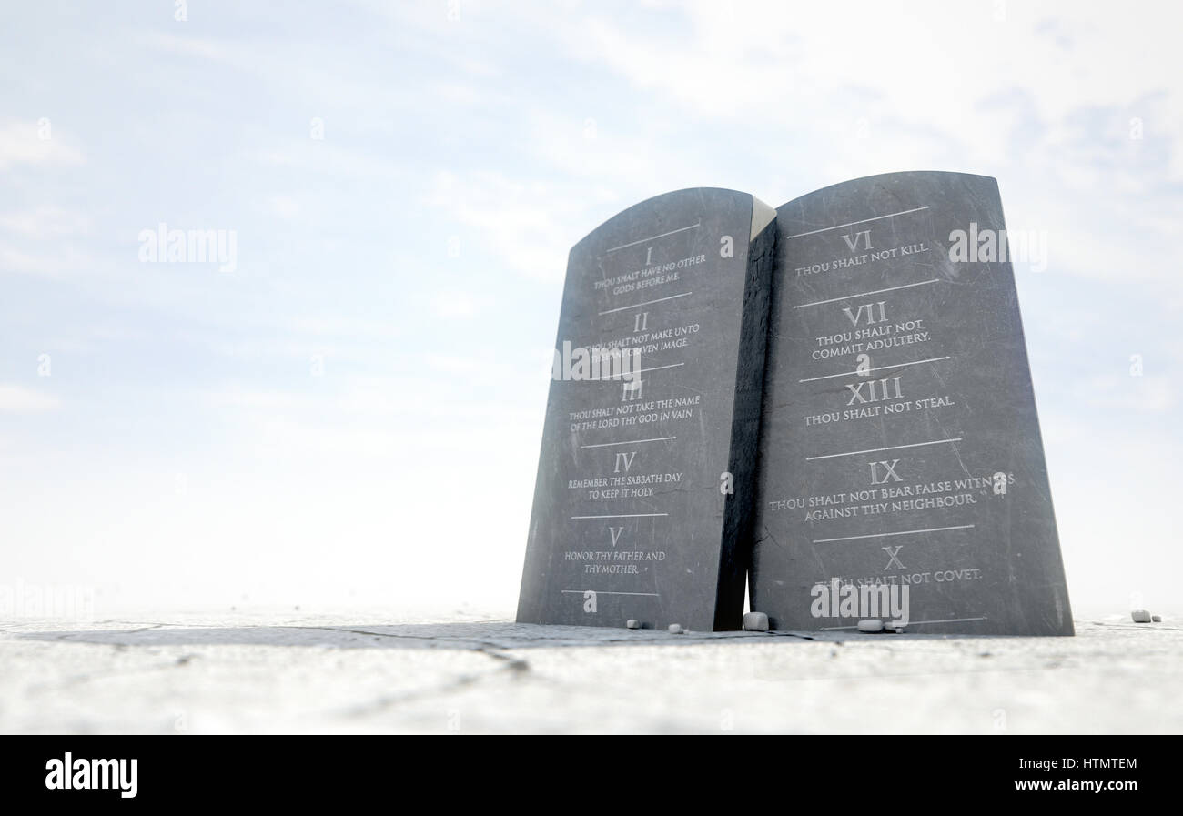 Two stone tablets with the ten commandments inscribed on them standing ...