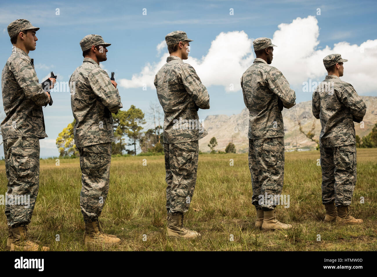 Standing army soldier holding weaponry uniform hi-res stock photography ...