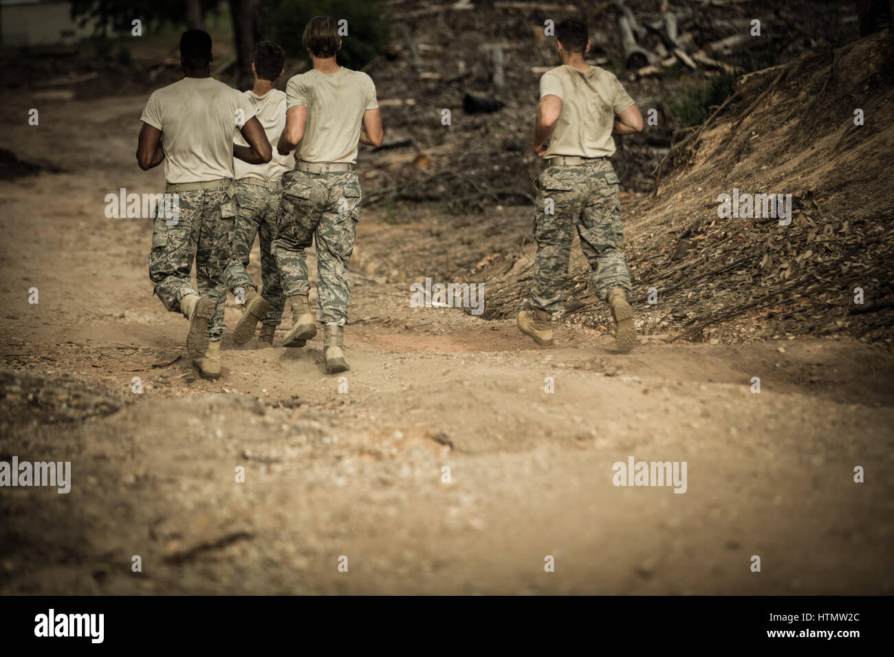 Rear view of Soldiers running in boot camp Stock Photo - Alamy