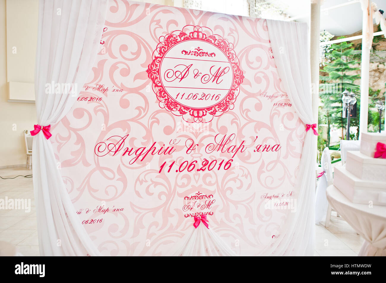 Rose and white banner photozone at wedding ceremony Stock Photo - Alamy