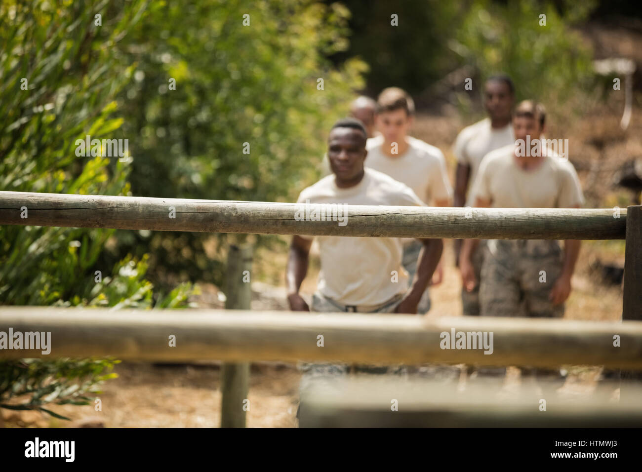 Military soldiers training on fitness trail at boot camp Stock Photo ...