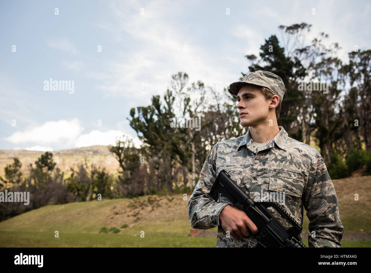 Army soldier teamwork holding military standing hi-res stock ...