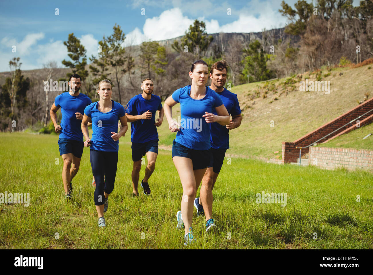 Woman running in boot camp hi-res stock photography and images - Alamy