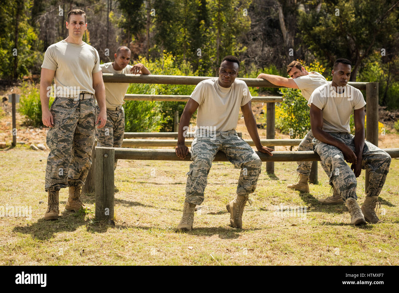 Military soldiers relaxing on fitness trail on a sunny day Stock Photo ...