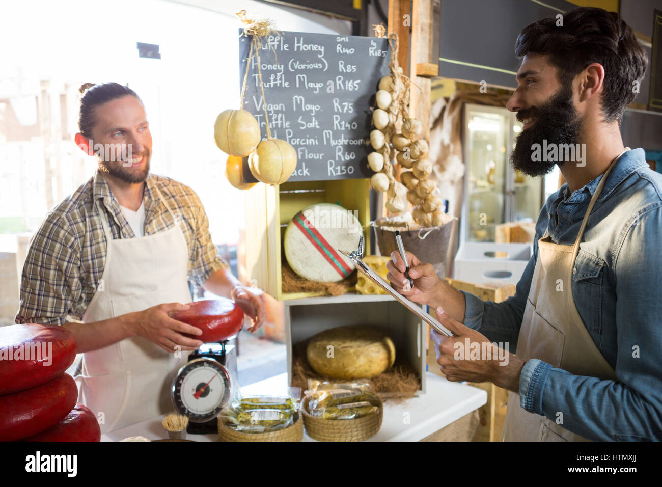 Man and salesman talking in shop hi-res stock photography and images ...