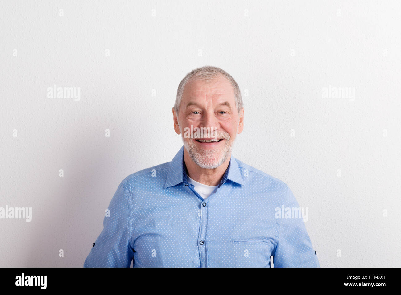Older man in blue shirt hi-res stock photography and images - Alamy