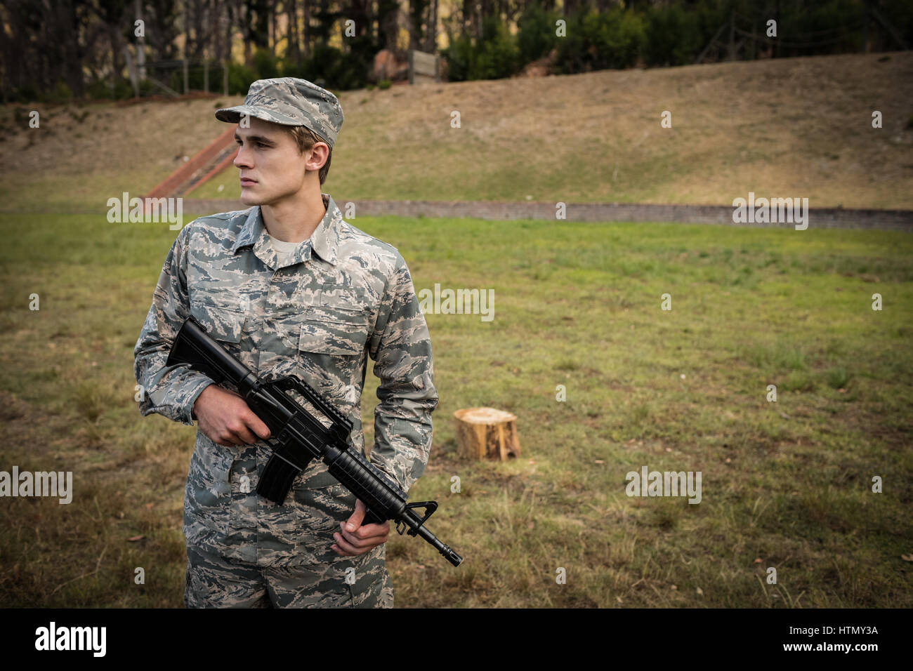 Military soldier guarding with a rifle in a boot camp Stock Photo - Alamy