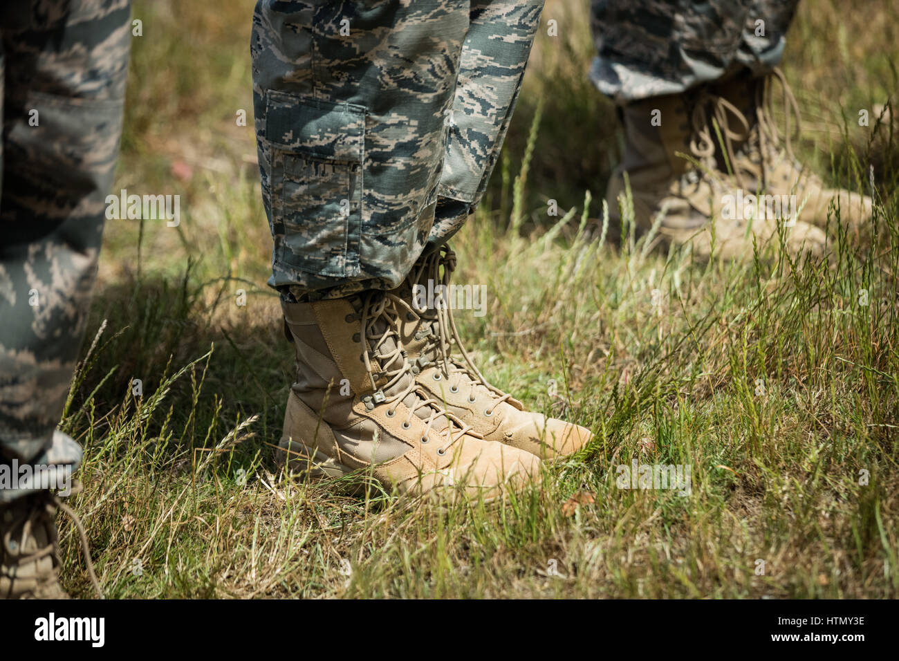 Low-section of military soldiers standing in line at boot camp Stock ...