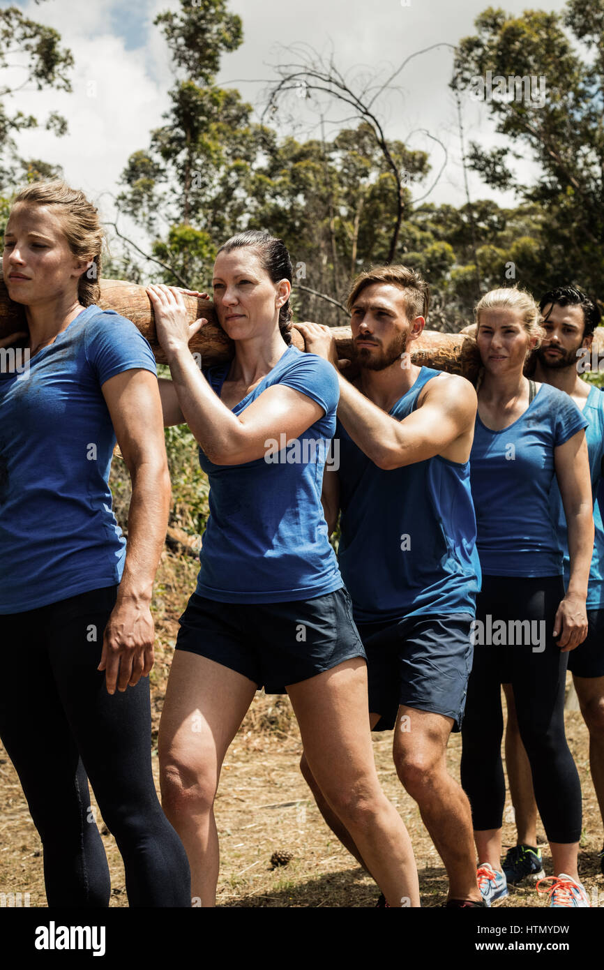 Woman carrying heavy wooden log hi-res stock photography and images - Alamy
