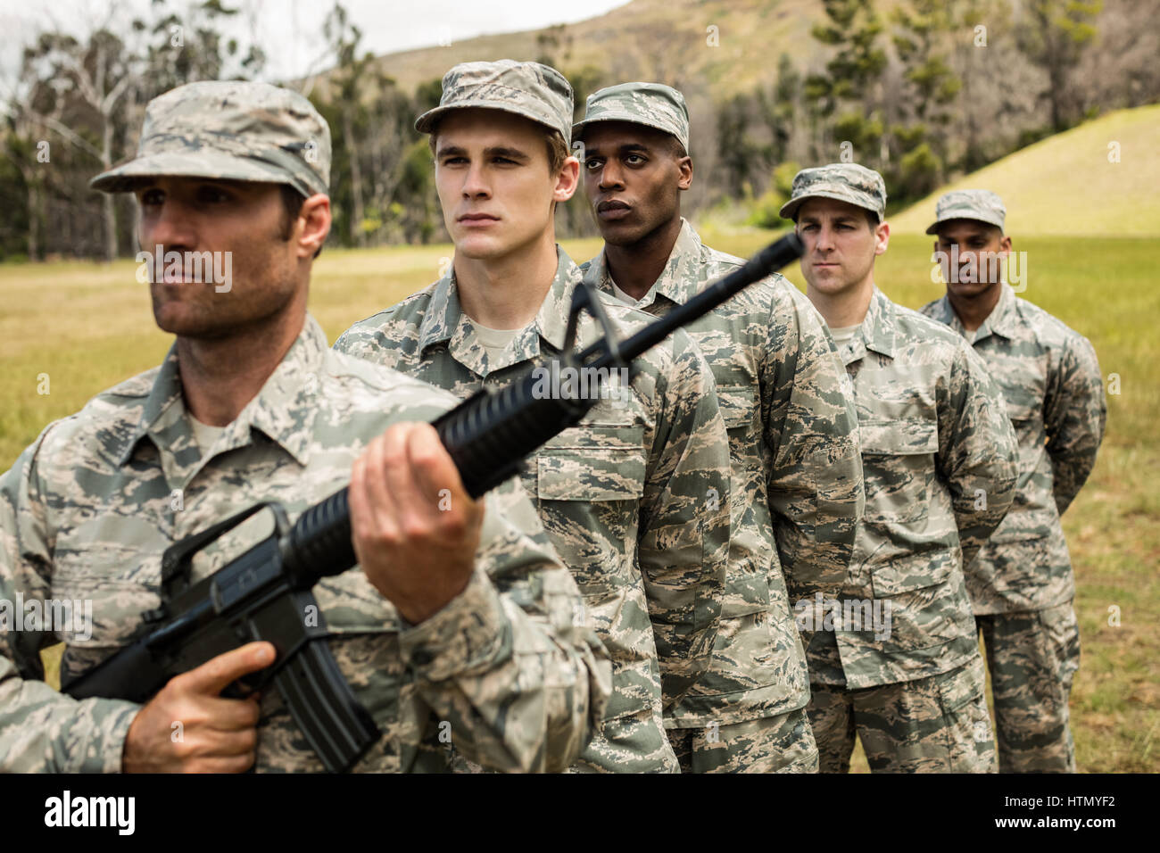 Group of military soldiers standing in line at boot camp Stock Photo ...