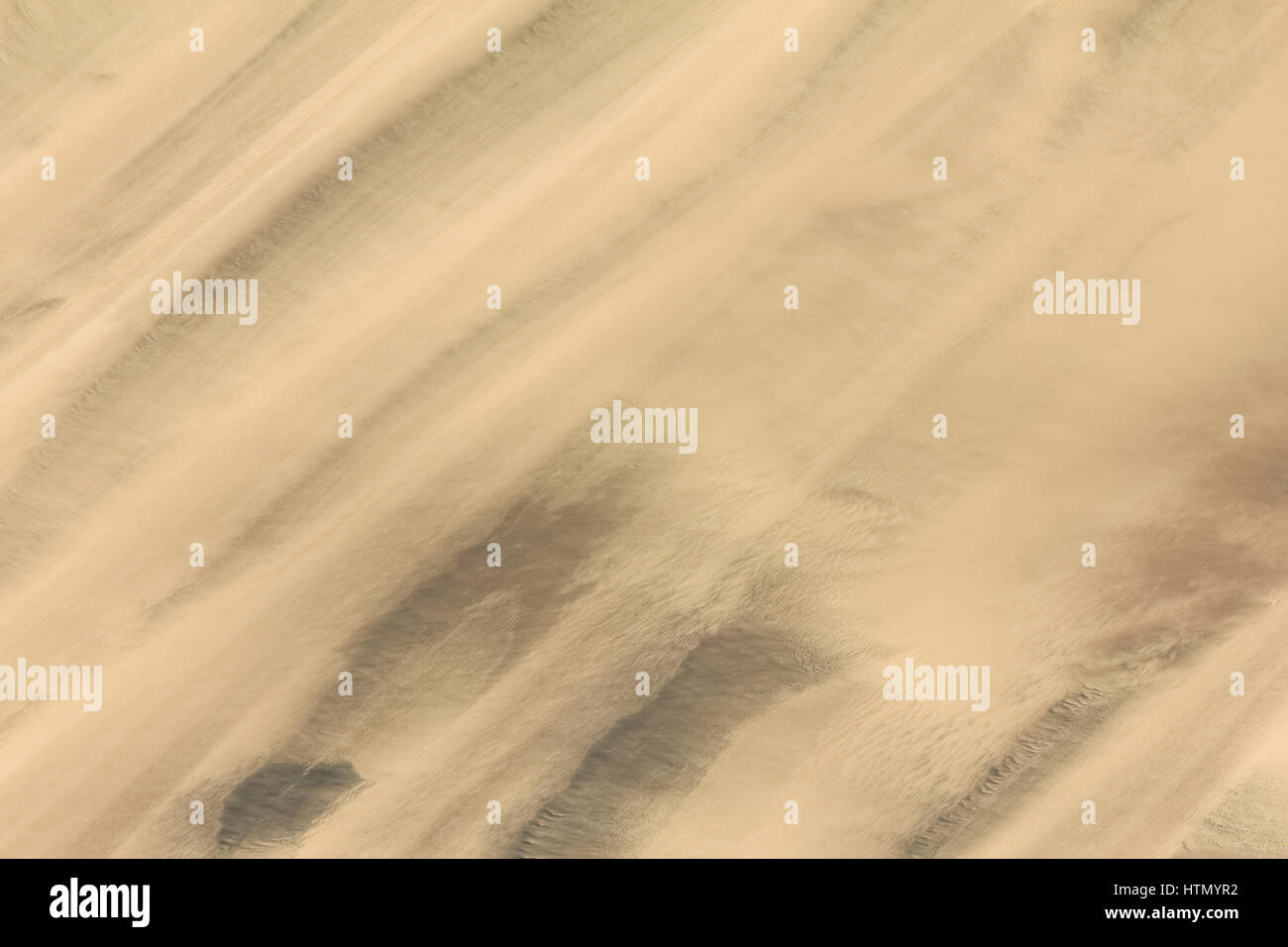 Trails of dust and shifting sand dunes textures Stock Photo - Alamy