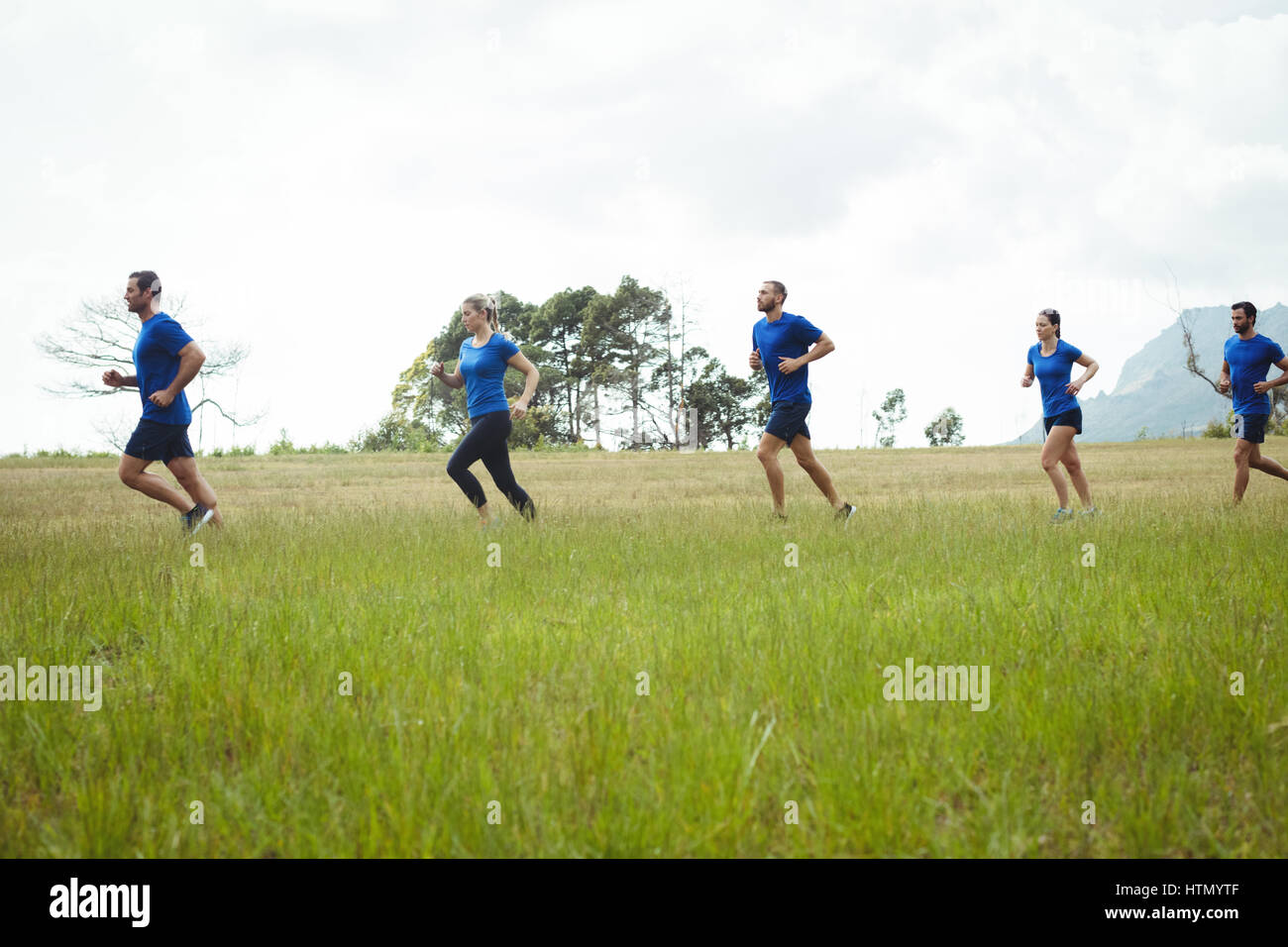 Woman running in boot camp hi-res stock photography and images - Alamy