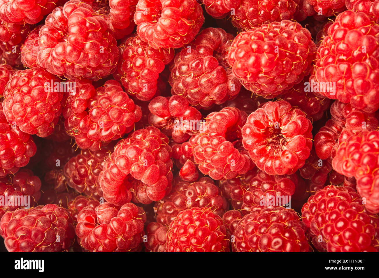 Raspberries background hi-res stock photography and images - Alamy