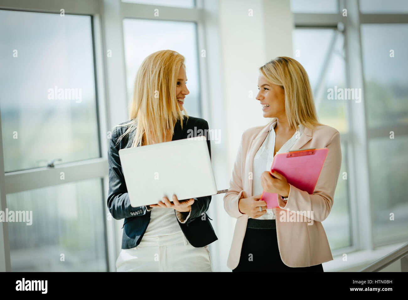 Professional busy businesswomen working at office Stock Photo - Alamy