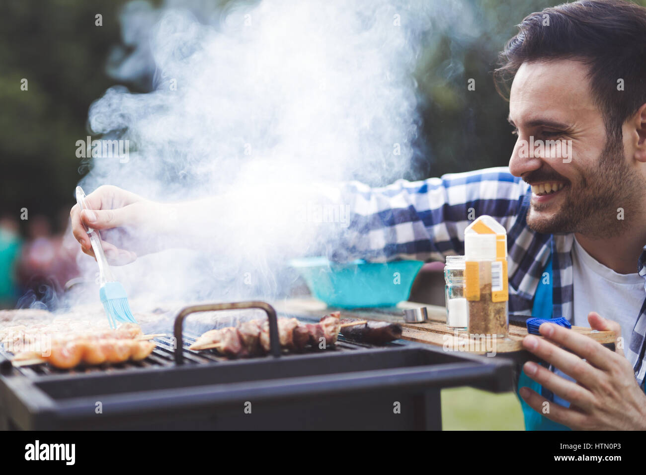 Male cooking at party hi-res stock photography and images - Alamy