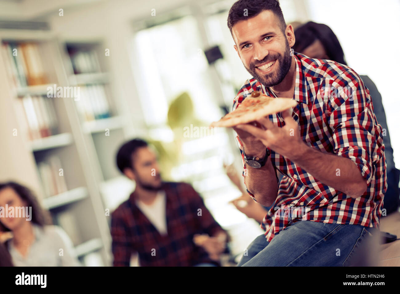 Colleagues corporate lunch break at work in company offices Stock Photo ...