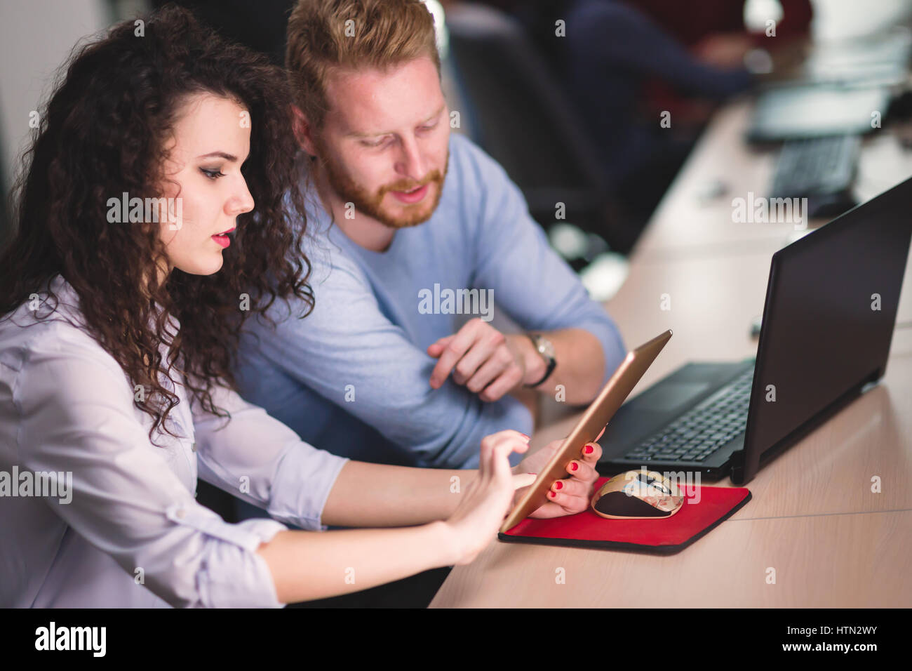 Programmer working in a software developing company office Stock Photo - Alamy