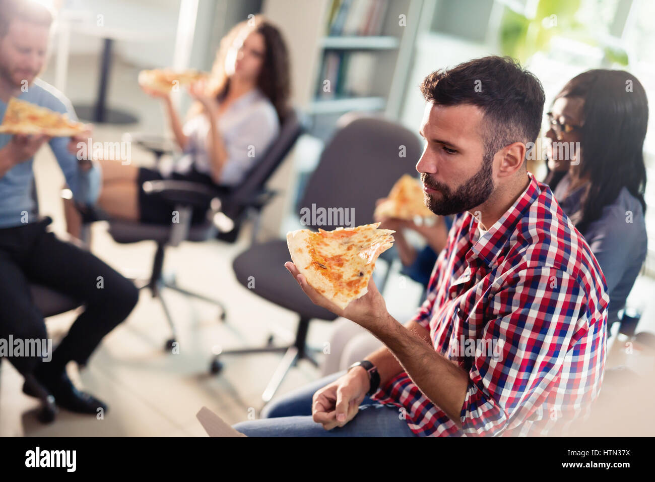 Colleagues corporate lunch break at work in company offices Stock Photo ...