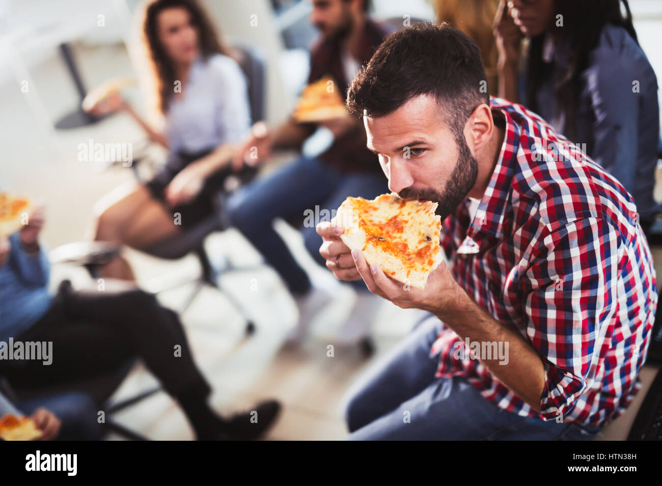 Colleagues corporate lunch break at work in company offices Stock Photo ...