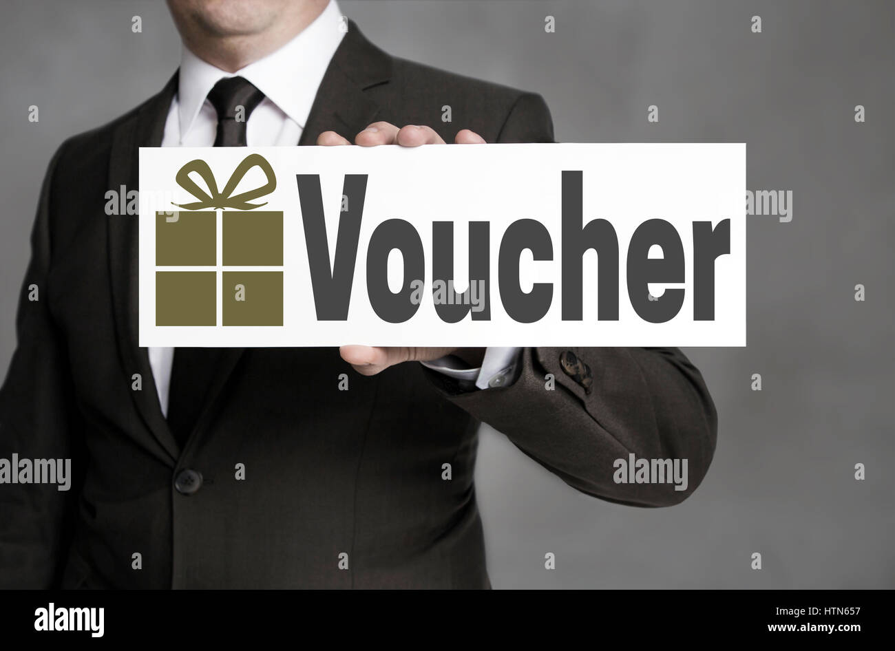 Voucher is held by a businessman Stock Photo - Alamy
