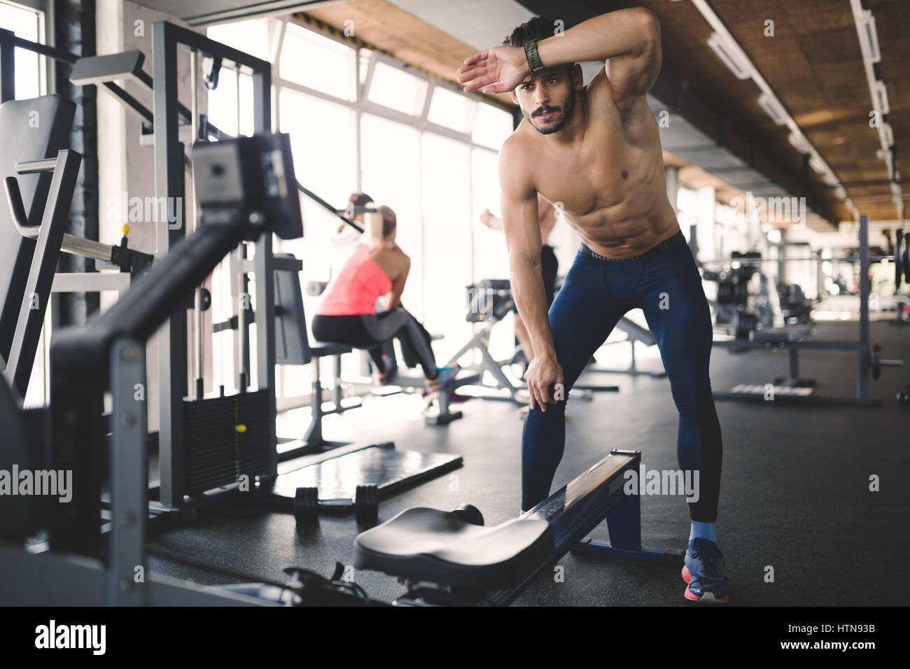 Determined people training and working out in gym Stock Photo - Alamy