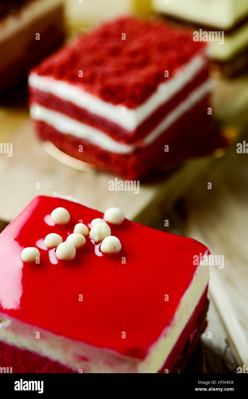 closeup of some square pieces of different delicious cakes Stock Photo ...