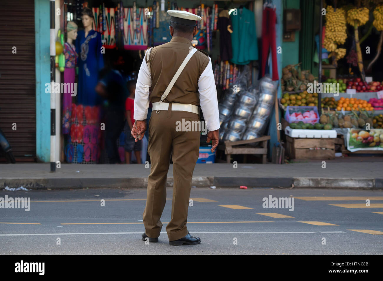 Policeman standing on street in Sri Lanka. The Sri Lankan police force ...