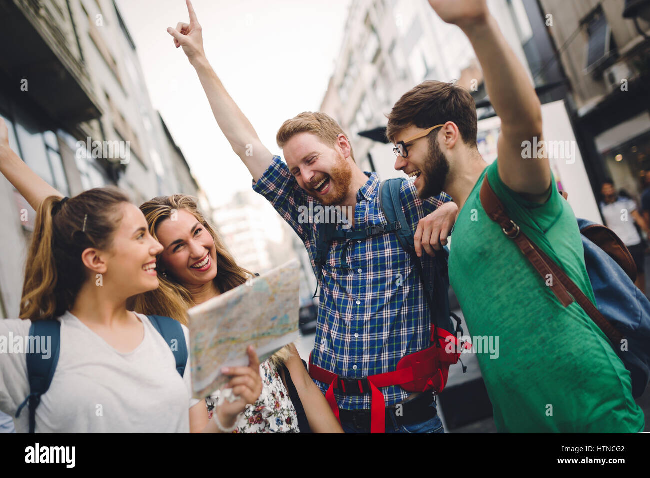 Happy group of tourists traveling and sightseeing together Stock Photo ...