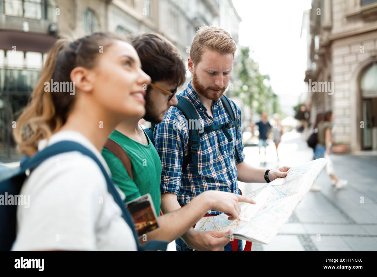 Happy group of students on sightseeing and travel adventure Stock Photo ...