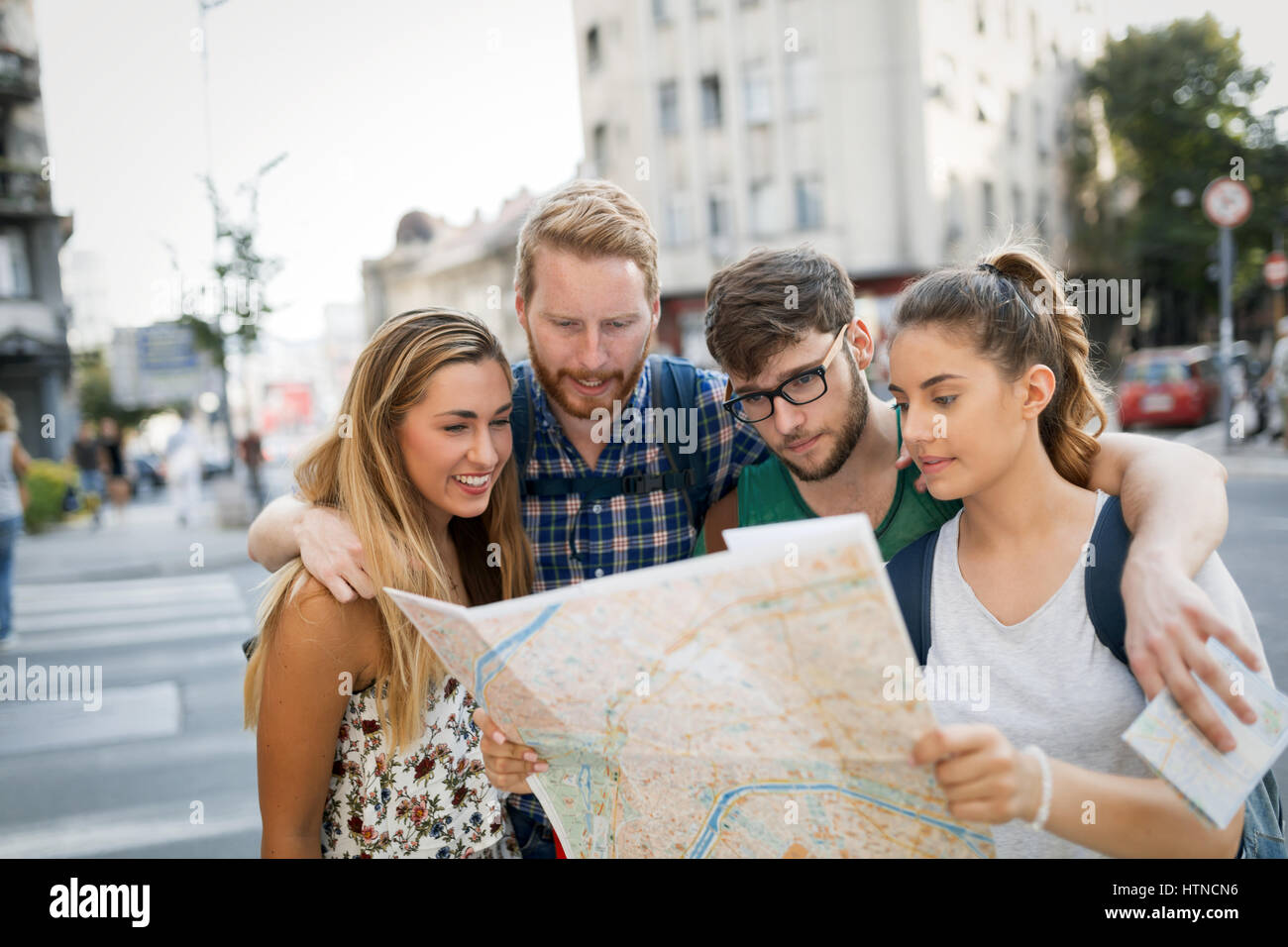 Tourist group of friends discovering city on foot and travelling Stock ...
