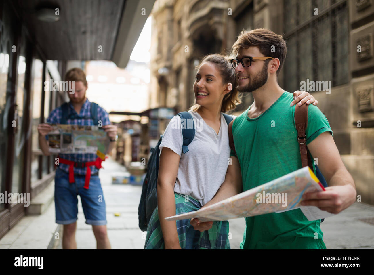 Happy group of students on sightseeing and travel adventure Stock Photo ...