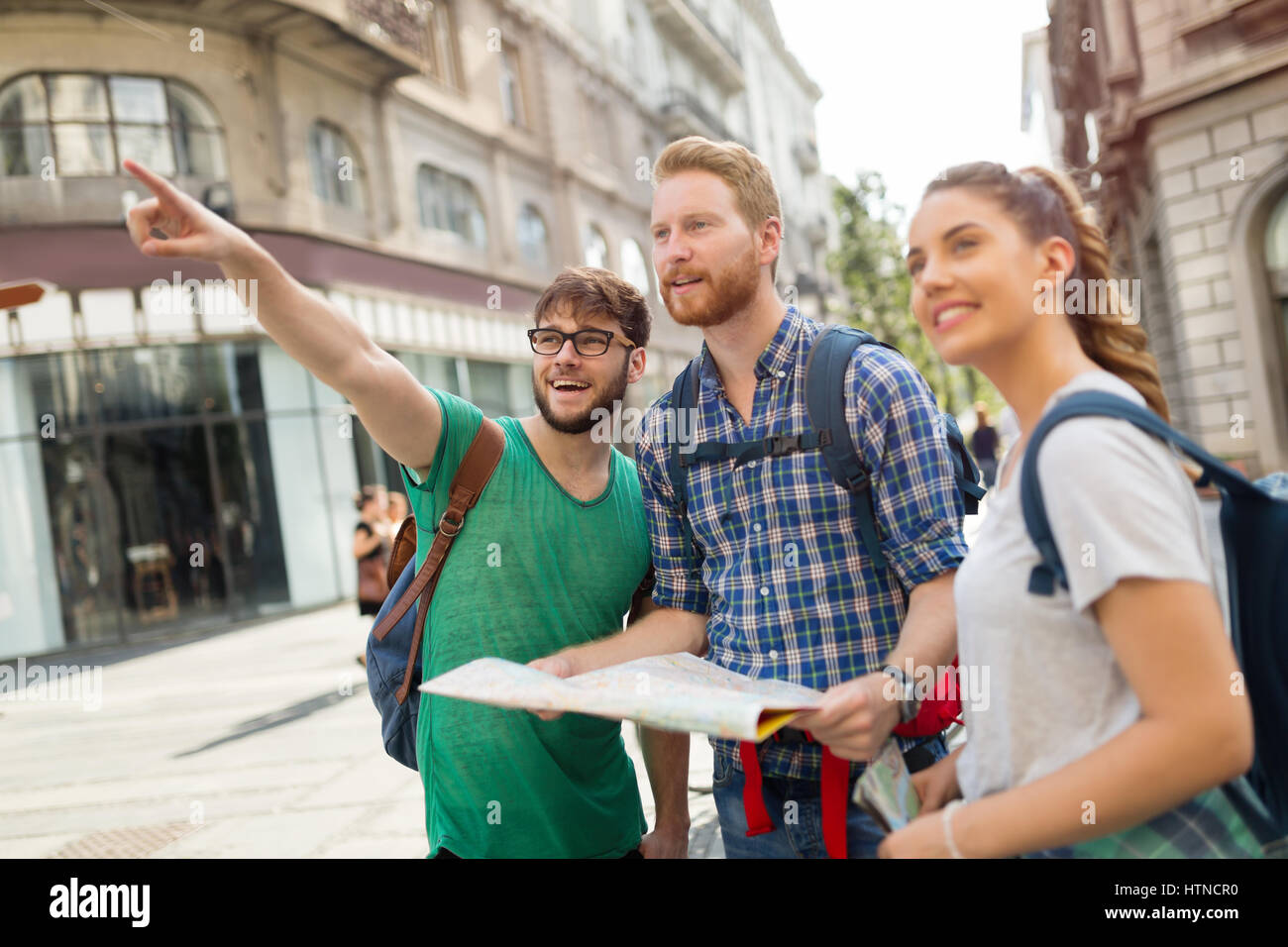Happy group of tourists traveling and sightseeing together Stock Photo ...