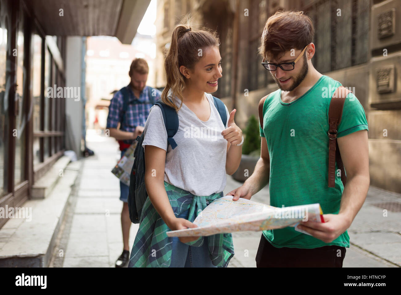Happy group of tourists traveling and sightseeing together Stock Photo ...