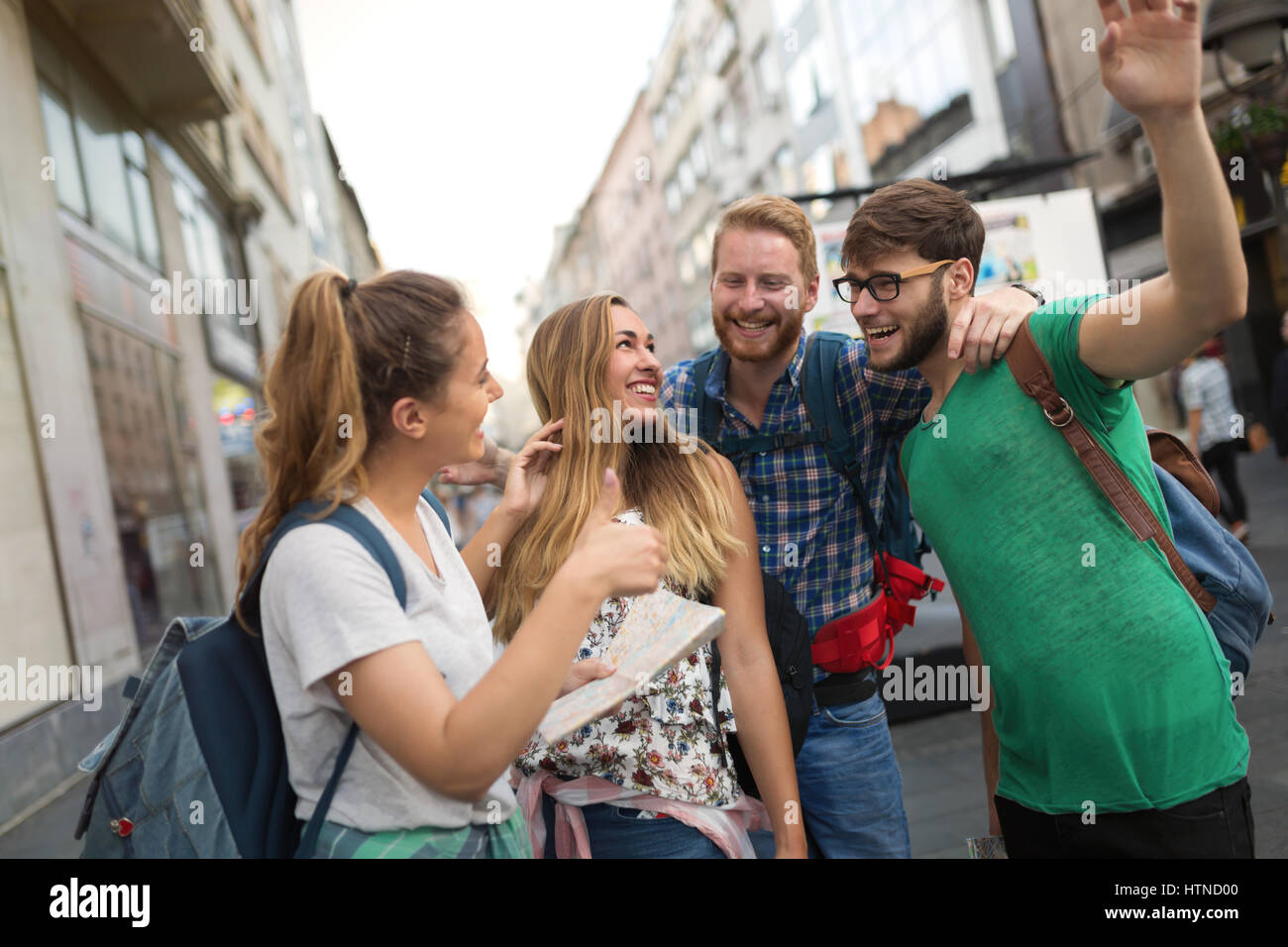 Happy young people having fun outdoors and smiling Stock Photo - Alamy