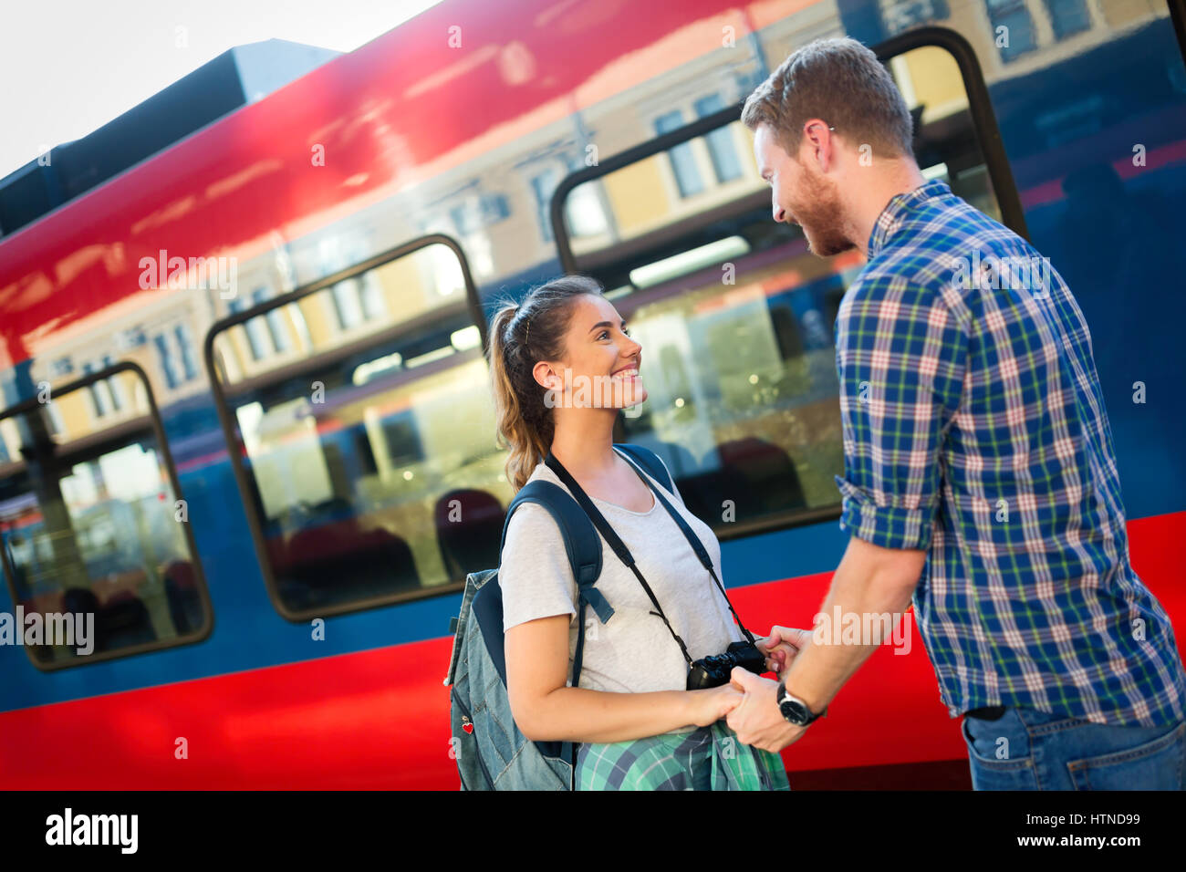 Couple in love reunion after traveler arrives Stock Photo - Alamy