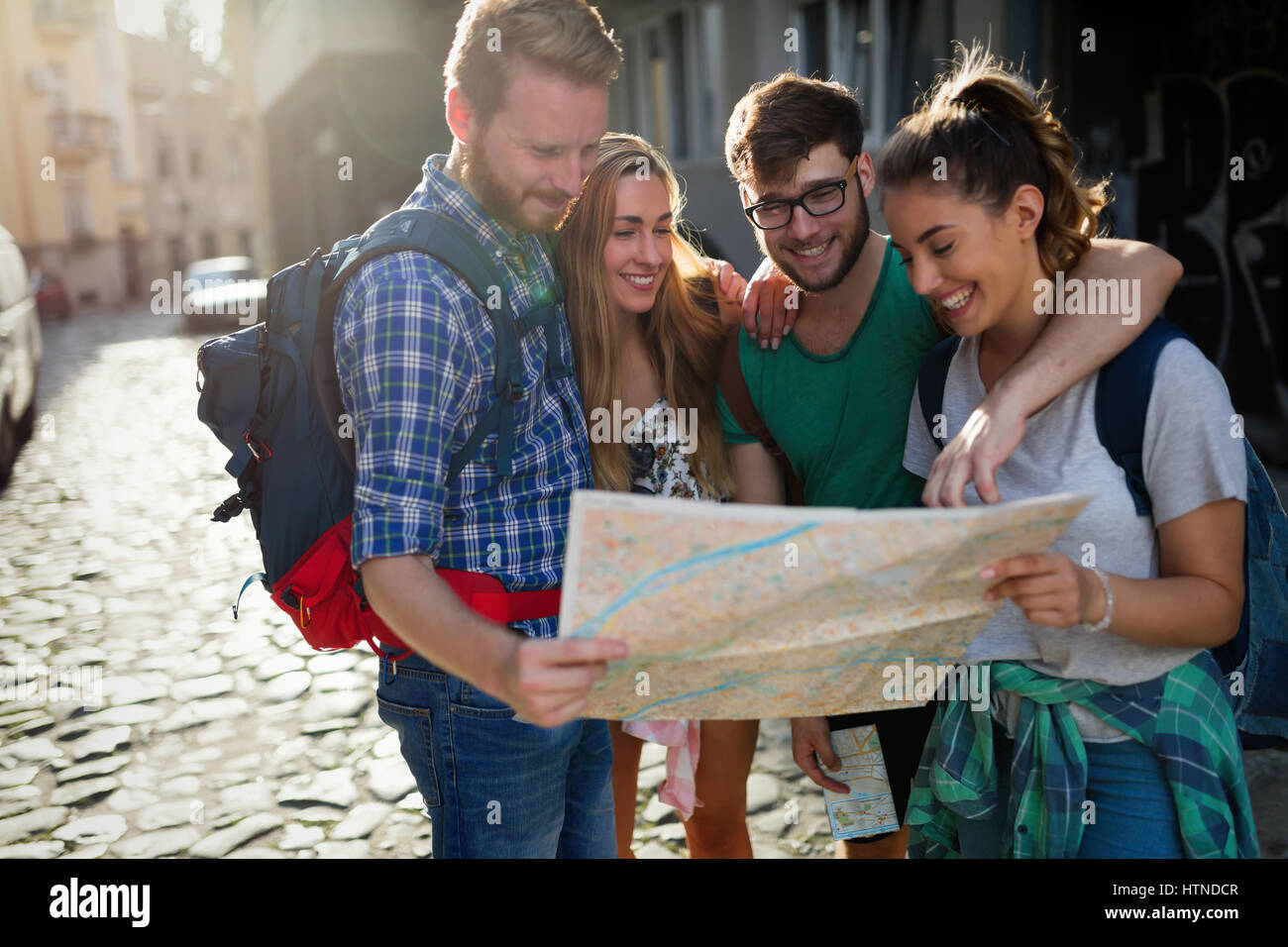 Happy young students on a travelling adventure Stock Photo - Alamy