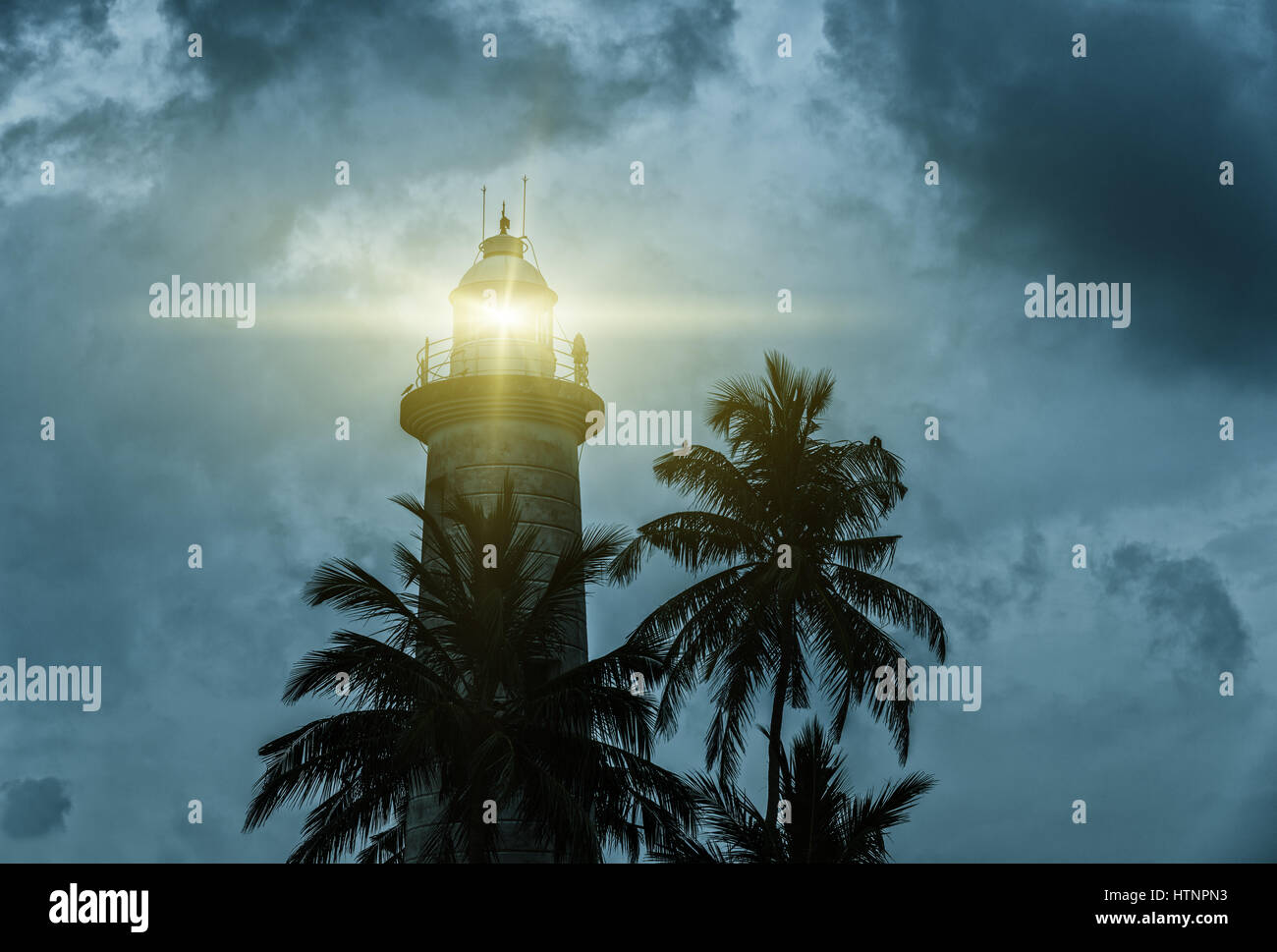 Lighthouse against dramatic sky Stock Photo - Alamy